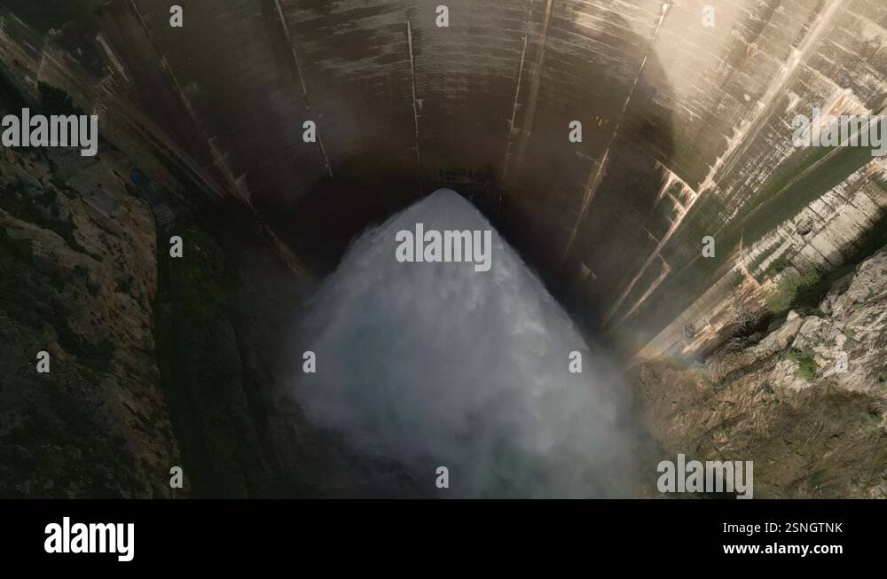 Water discharge from a dam inside a mountain canyon. Howell Bunger ...