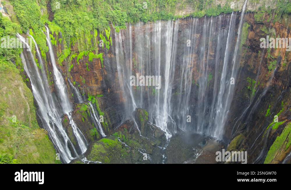 Drone pan from left to right at tumpaksewu waterfall in Java, Indonesia ...