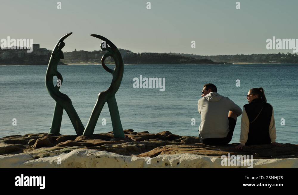 An Australian couple in Manly sat next to The Sea Nymphs statue 4K ...