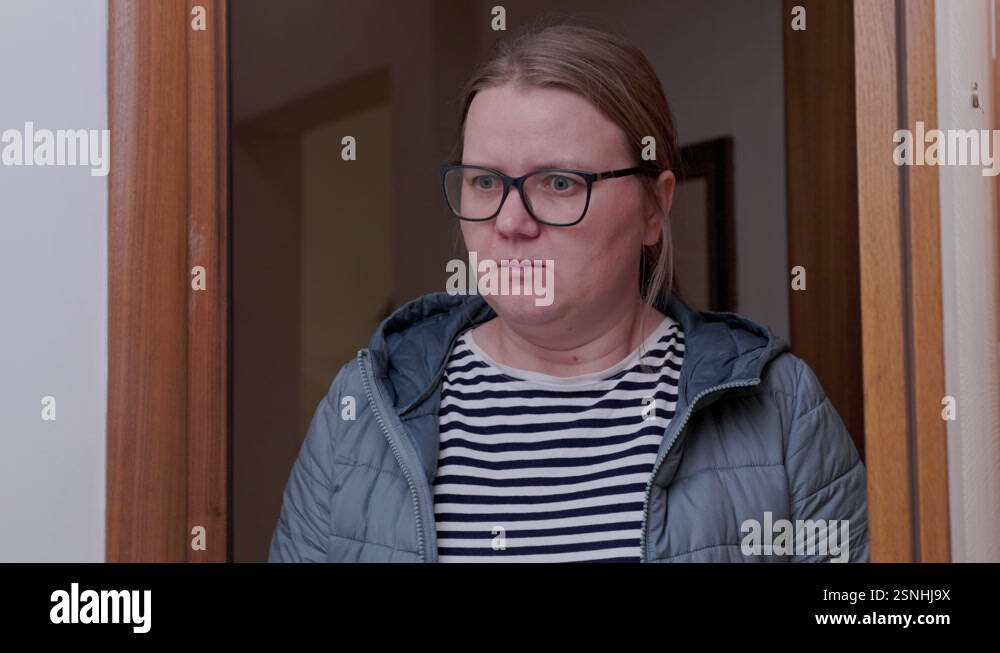 Parental anger Woman at the door shakes her fist, emotion of shock and ...