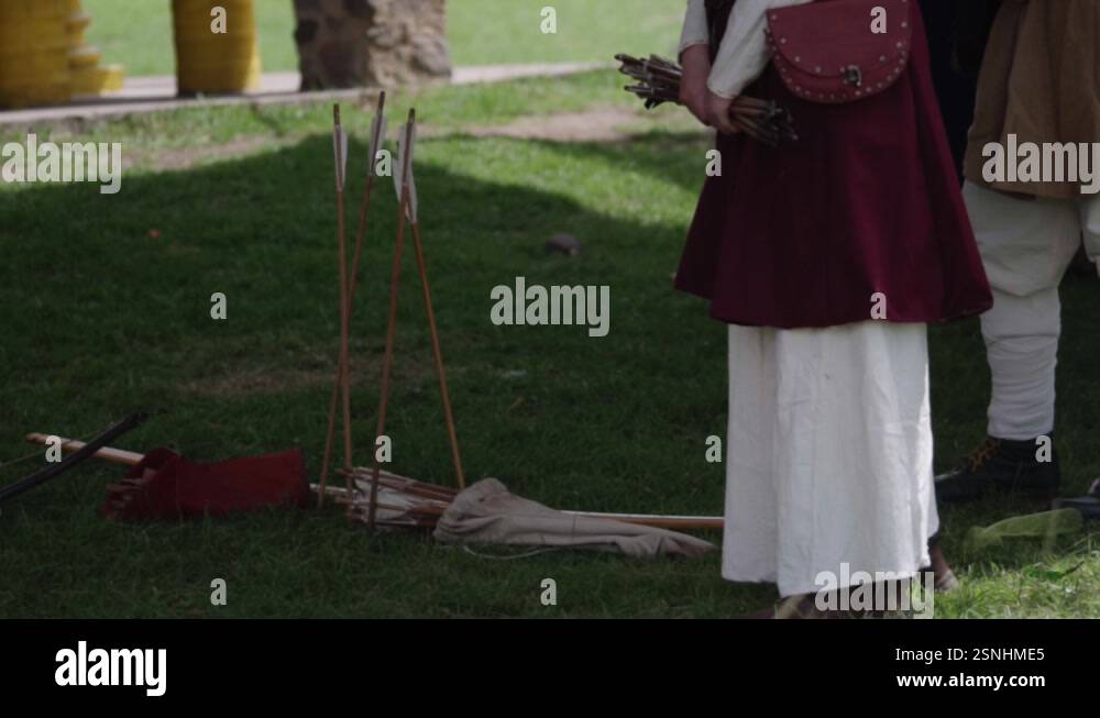 Traditional medieval archery setup with arrows, quivers, and a bow ...