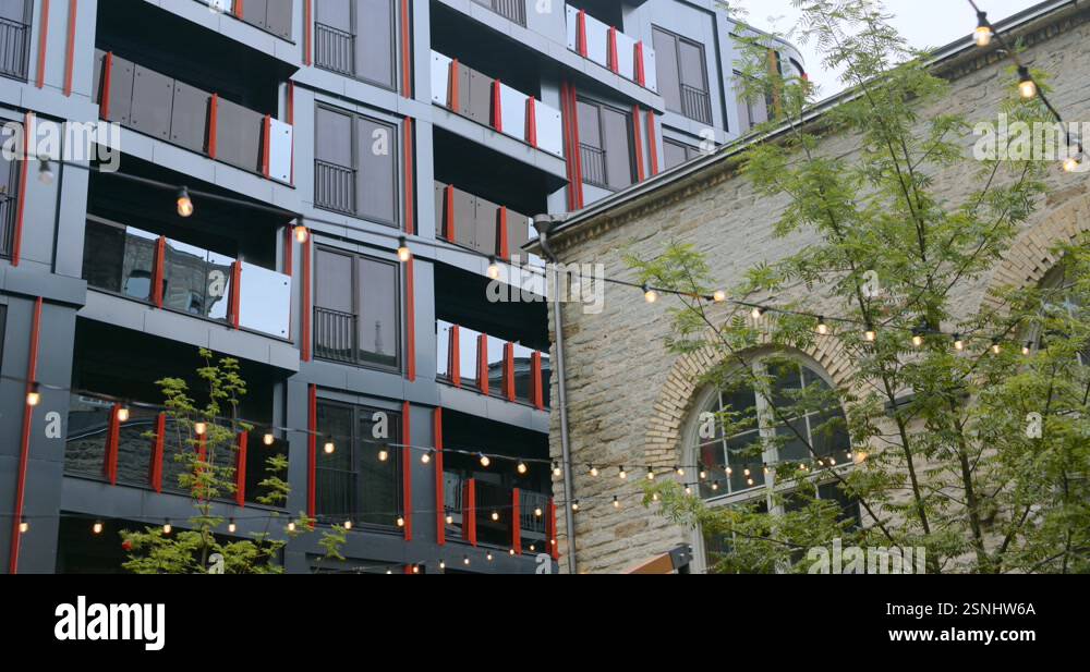 Juxtaposition of modern architecture with historic brick building in ...