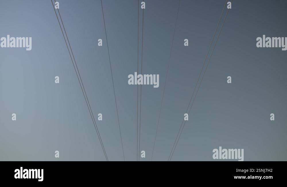 Minimalist Tilt Down Along Power Lines in Solar Farm Field, Renewable ...