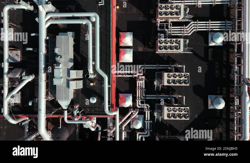 Close-Up of HVAC Piping System on Rooftop with Spinning Fans, Top-Down ...