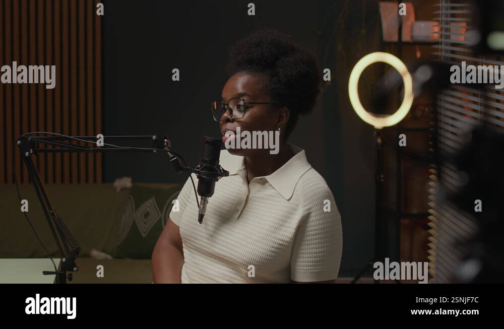 Young Black Female Radio Host Speaking in Mic in front of Filming ...