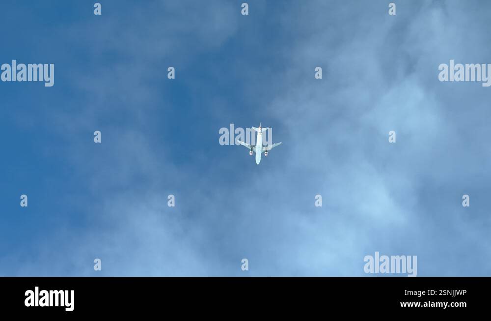 Jet flying through some frayed clouds recorded from a jet cockpit ...