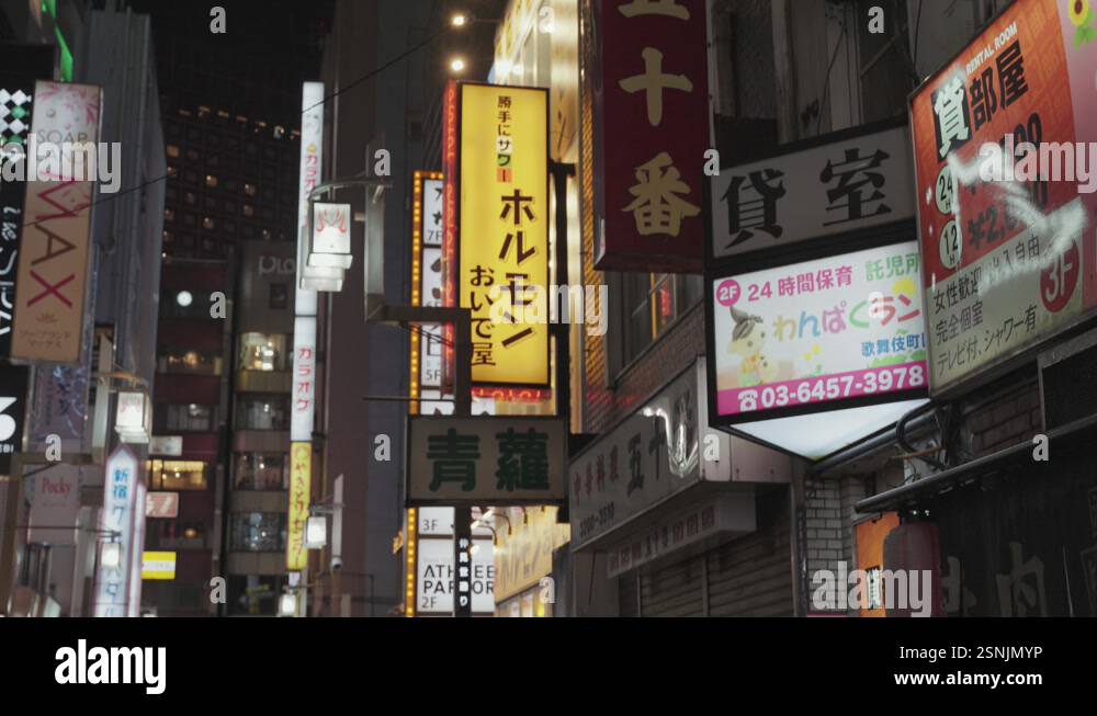 Nighttime shots of Shibuya Tokyo reveals vibrant neon lights, bustling crowds Stock Video ...