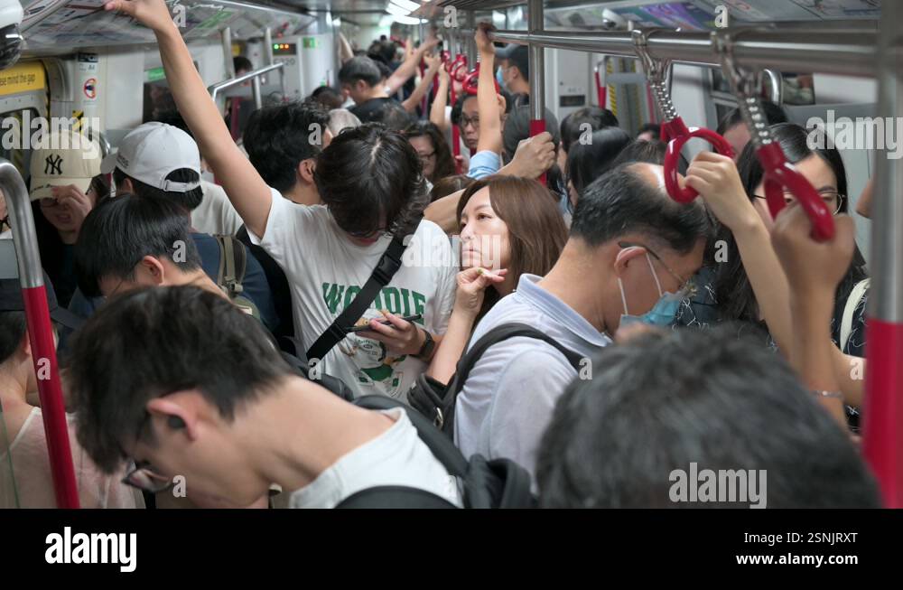 Inside Packed Subway Train During Rush Hour with Commuters Holding ...
