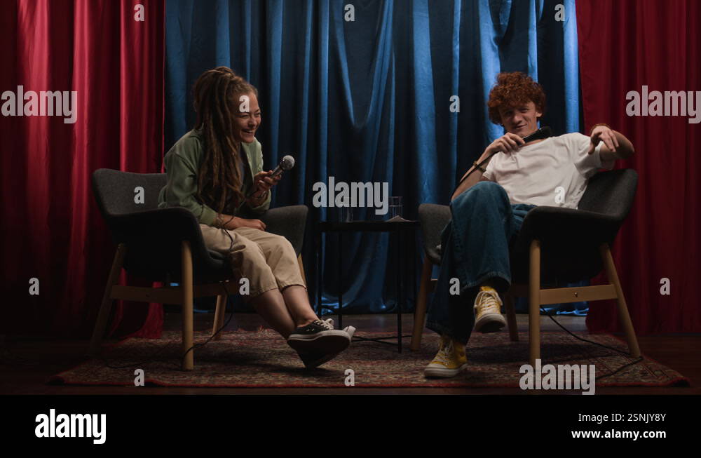 Two Stand-Up Comics Speaking and Telling Jokes on Stage in Club Stock ...