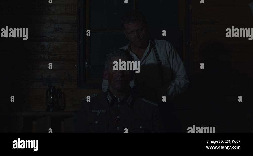 A hostage taker takes his knife from the throat of a captured German ...