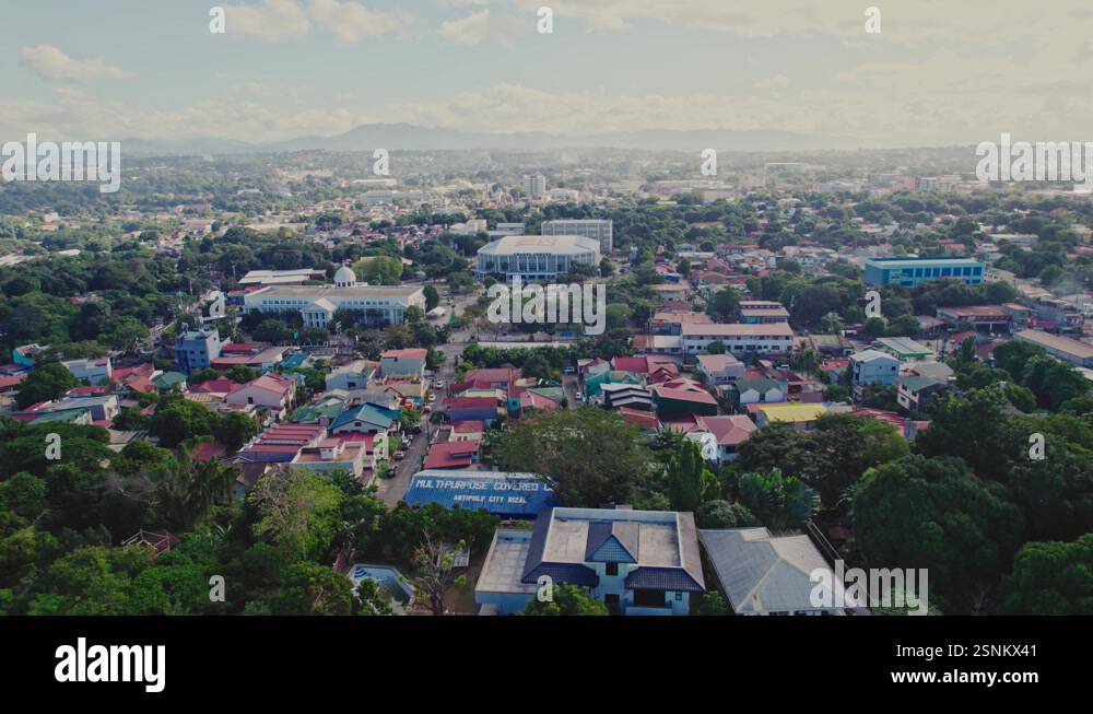 A drone shot capturing the view of Manila from Antipolo, with lush trees Stock Video Footage - Alamy
