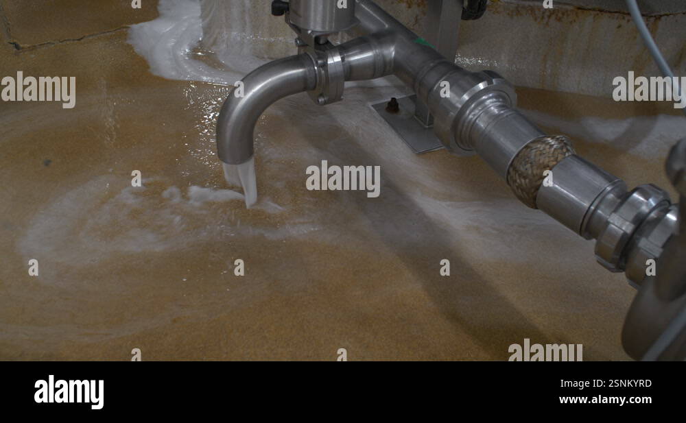 Water flowing from waste outflow pipe tap food processing factory Stock ...