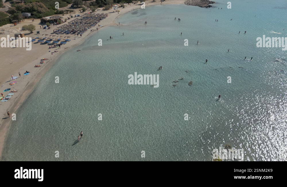 People Swim And Sunbathe At Famous Elafonissi Beach In Crete Greece 4K ...