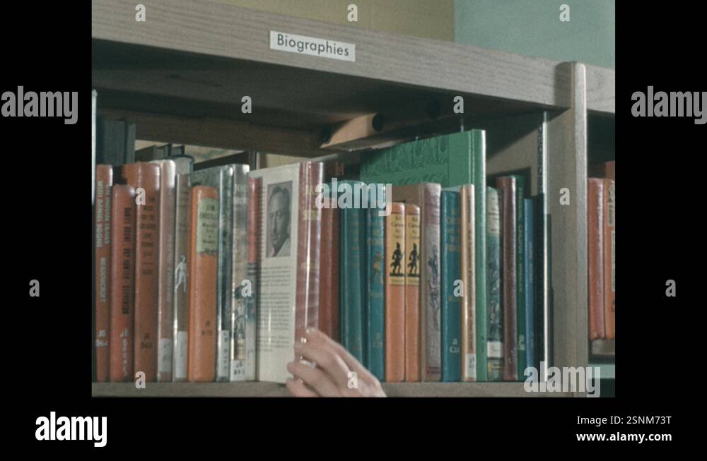 1960s: Hands with clapboard, hand places book on shelf, woman enters ...