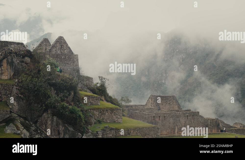 Dense Clouds On Mountains At The Historic Sanctuary of Machu Picchu In ...