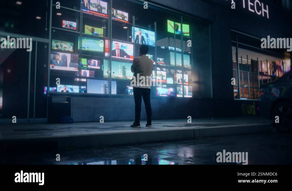 Storefront Television Display with a Man Watching Broadcast Channel ...