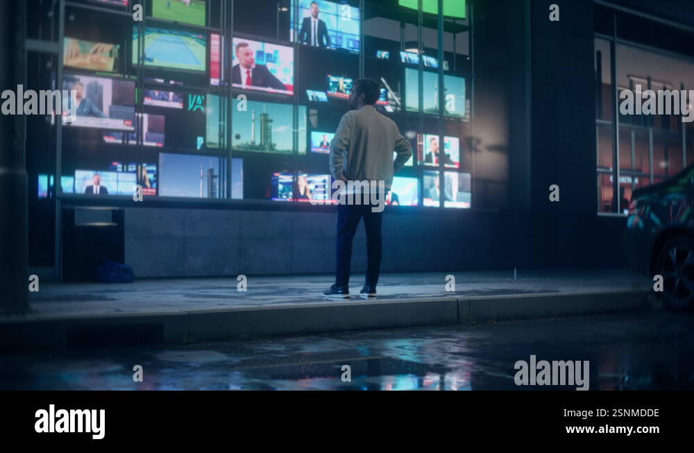 Storefront Television Display with a Man Watching Broadcast Channel ...