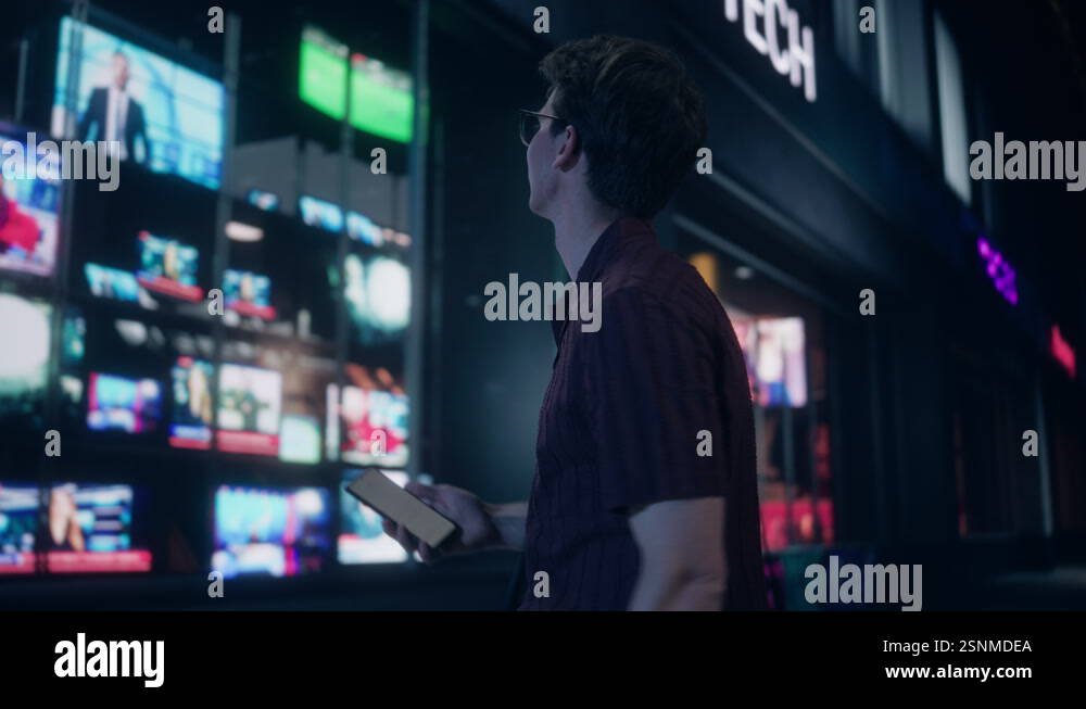 Storefront Television Display with a Man Watching Broadcast Channel ...