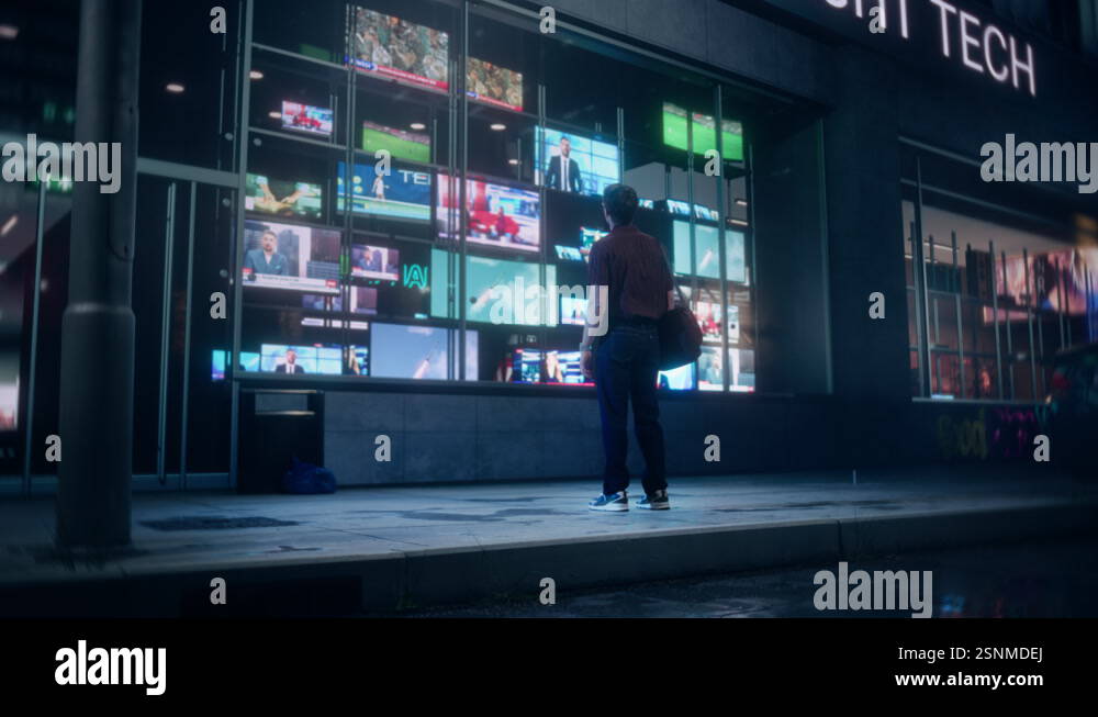 Storefront Television Display with a Man Watching Broadcast Channel ...