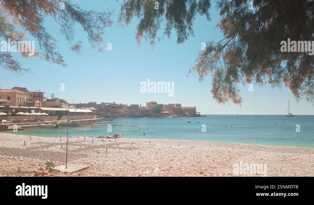 People relax Greek Mediterranean holiday resort Gerolimenas beach Stock ...