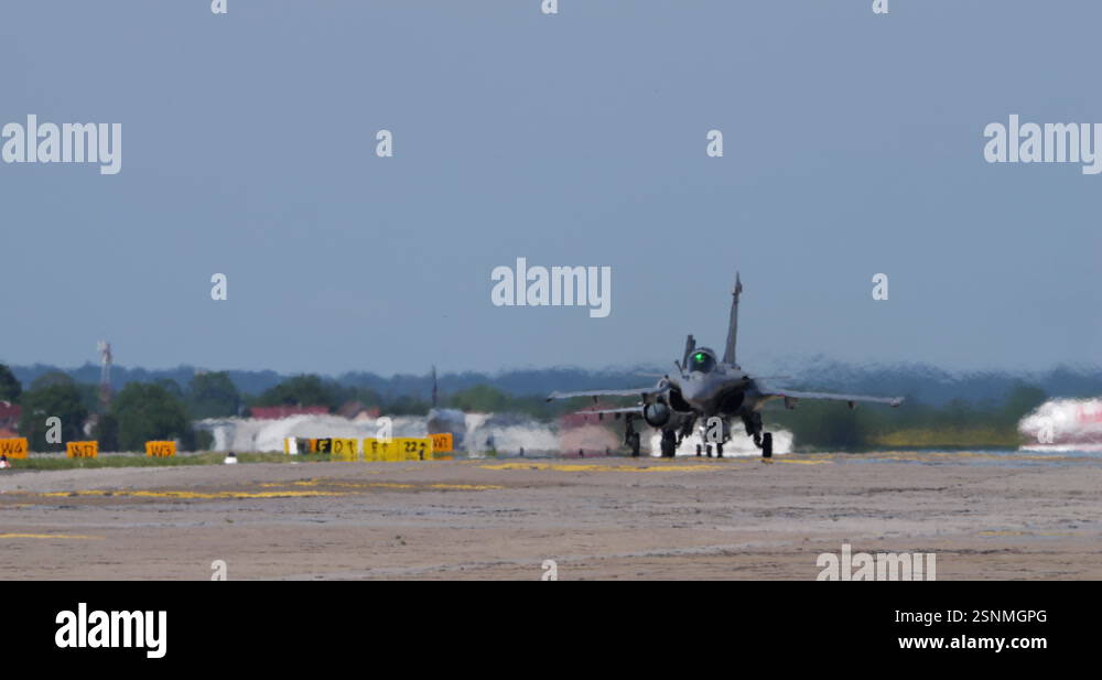 Modern Dassault Rafale And Cold War MiG-21 Aircraft Taxiing On Runway ...