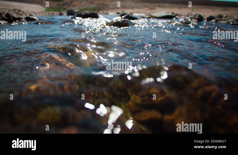 Close-up view of the small river flowing in the water source area Stock ...