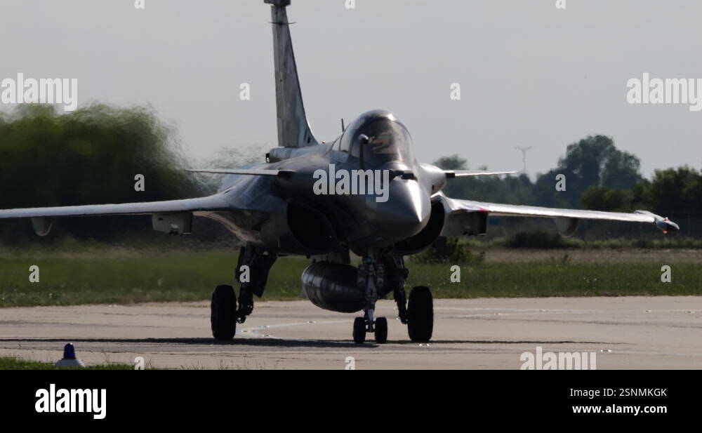 Modern Fighter Jet Taxiing Slowly on Runway Seen Up Close from Front ...