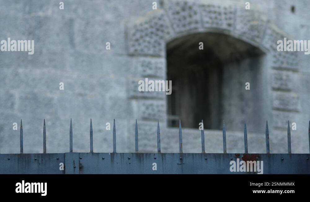 Massive iron gates with sharp spikes on top at abandoned military base ...