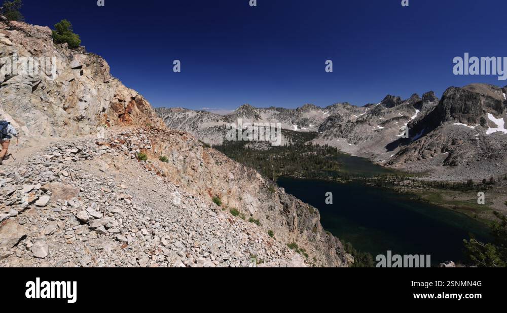 Backpackers hike over Snowyside Pass in Idaho's Sawtooth Mountains ...