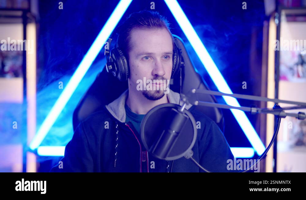 Male gaming streamer playing and communicating via microphone 4K Stock ...