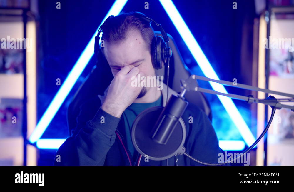 Male gaming streamer getting eye fatigue with pain after long game ...