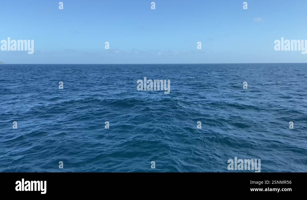 Deep ocean water light waves, clear skyline blue sky, sea dark blue ...