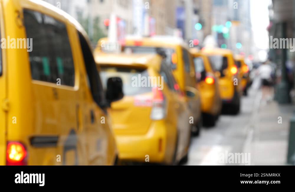 Row of yellow taxi cars, New York City Manhattan street. Defocused taxi ...