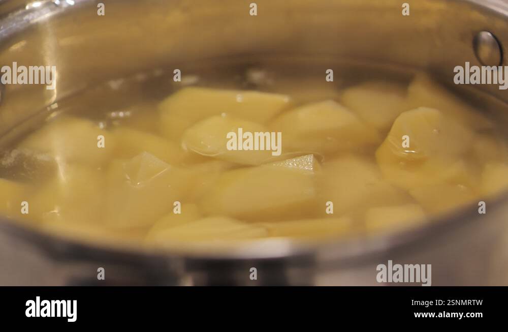 Boiling Potatoes in Stainless Steel Pot - A Classic Cooking Process ...