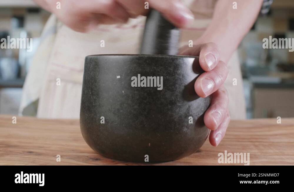 4K Close-Up: Crushing Garlic Cloves with Mortar and Pestle Stock Video ...