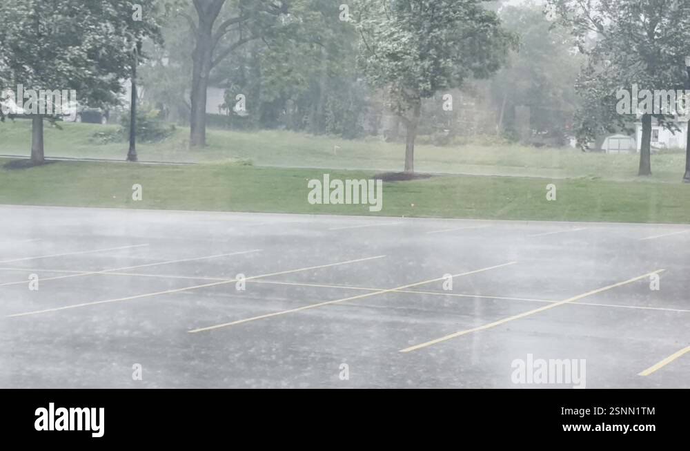 Heavy rainfall on a parking lot in Lansing, Michigan Stock Video ...