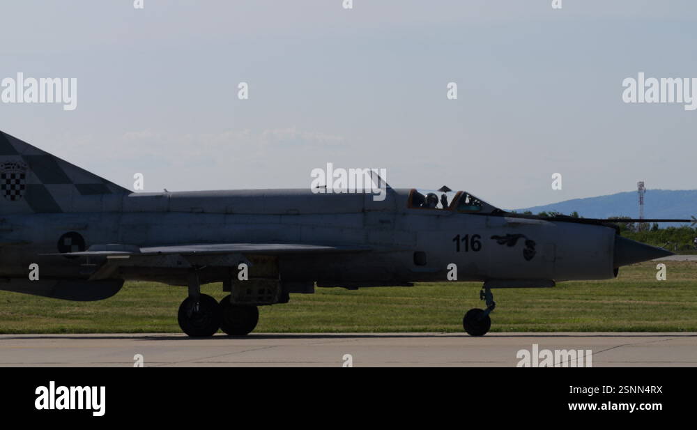 MiG-21 Fighter Jet Parked Side View with Pilot Waving from the Cockpit ...