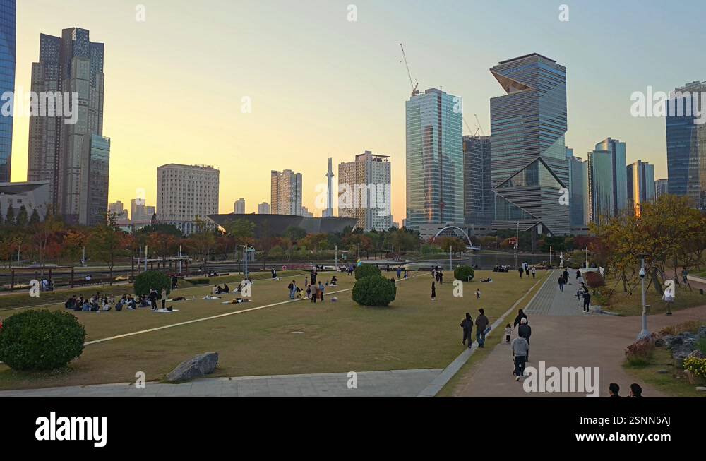 Songdo Central Park At Sunset With Locals And Skyline In Incheon, South ...