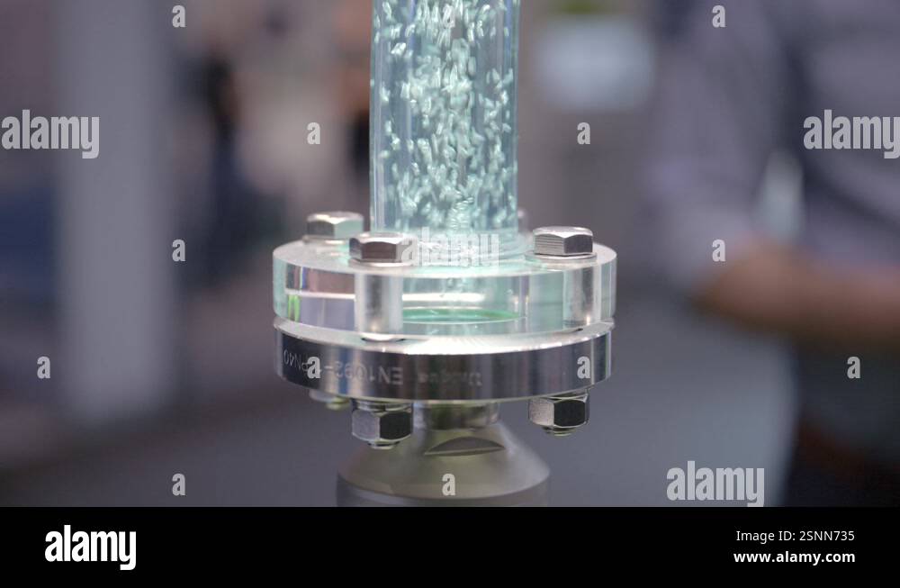 Hydrogen gas is bubbling trough a transparent pipe, slow motion ...