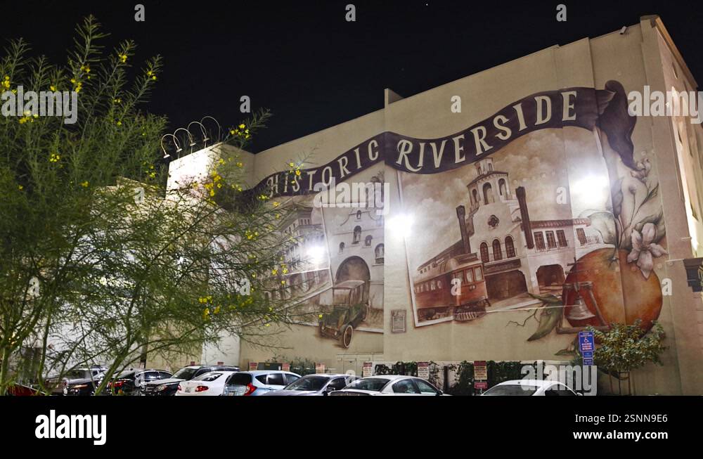 historical riverside landmark mural painting on a large wall at night ...