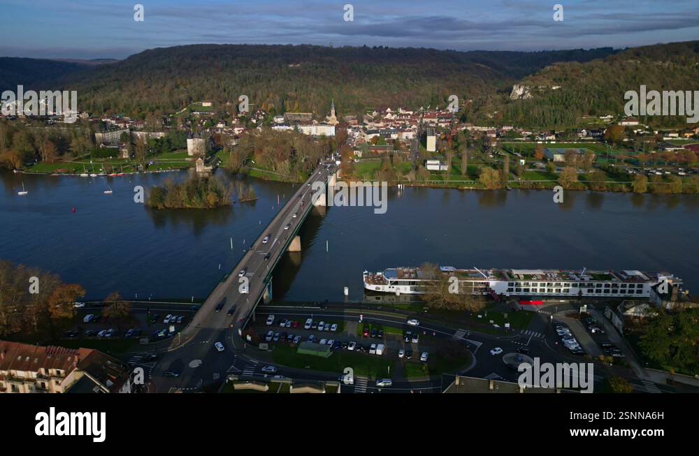 Sideways drone movement near the Pont Clémenceau bridge with a barge on ...