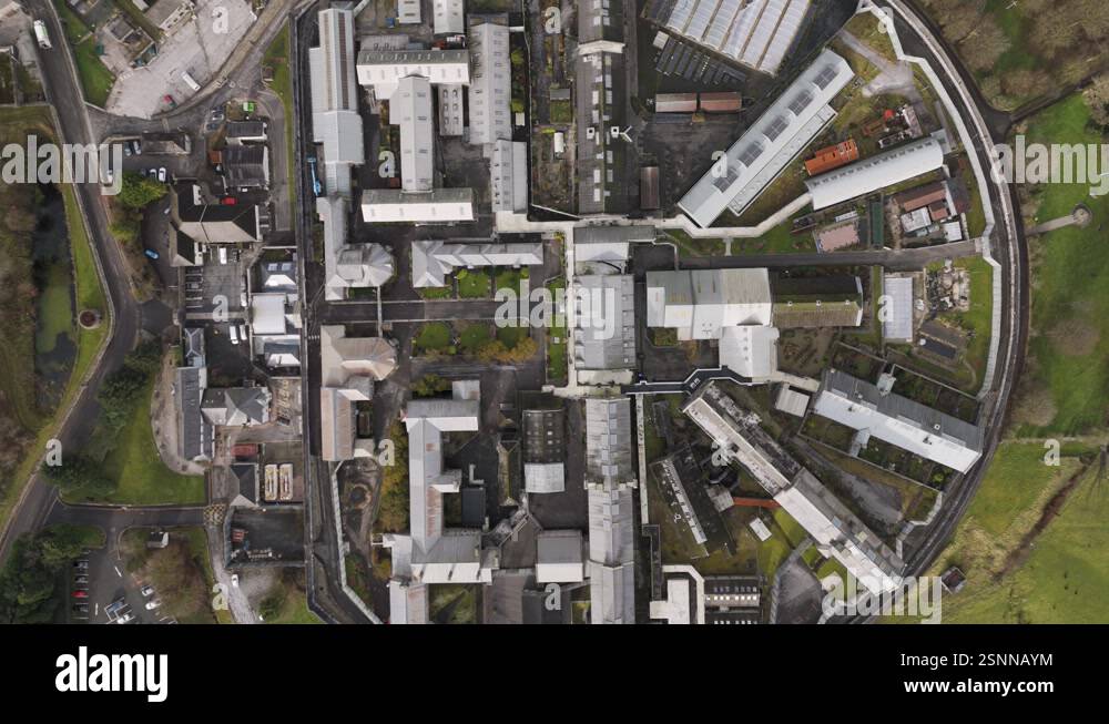 Top-down aerial fly-in of HM Prison Dartmoor focusing on compact ...