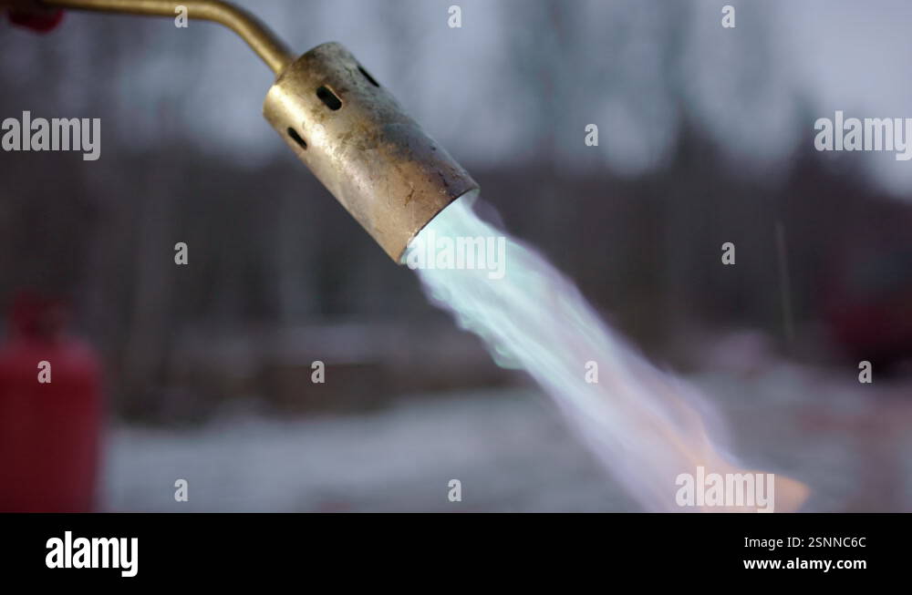 Long lighter used to light up LPG gas blow torch, close-up with ...