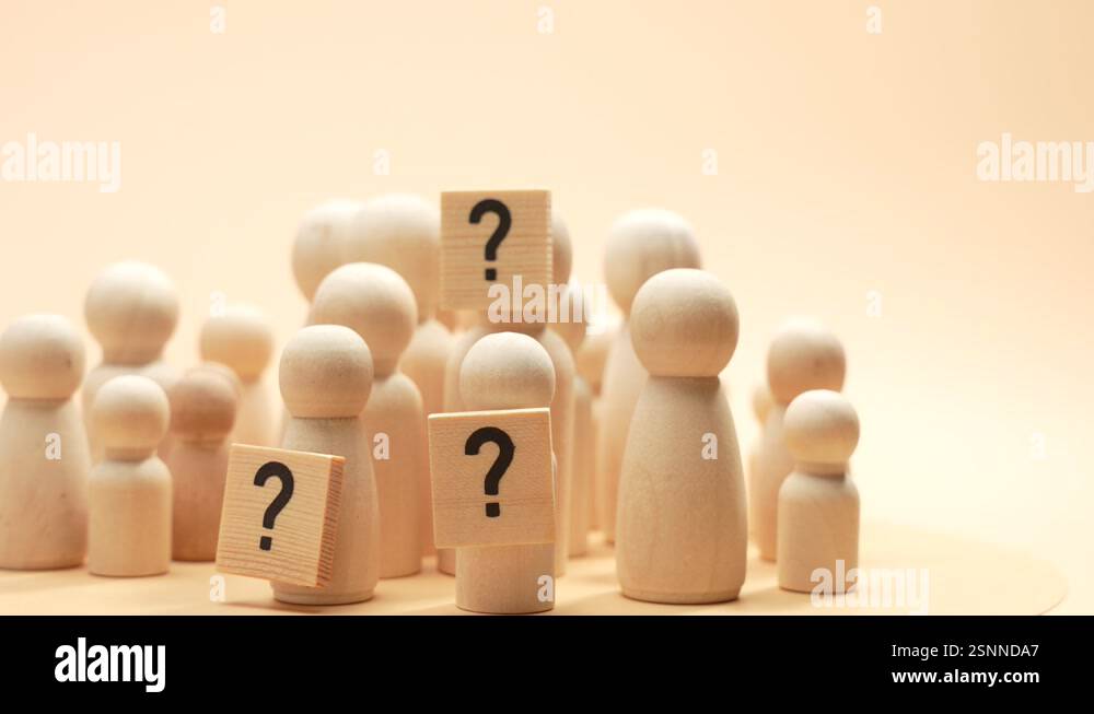 Rotating A group of wooden people holding a question mark Stock Video ...