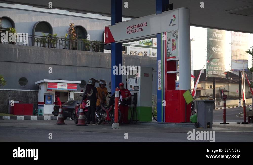 Vehicles queue at the Pertamina gas station Stock Video Footage - Alamy