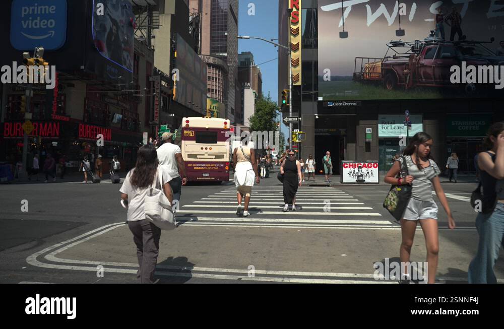 Pedestrians and Tour Bus Crossing a Busy Intersection in Times Square ...