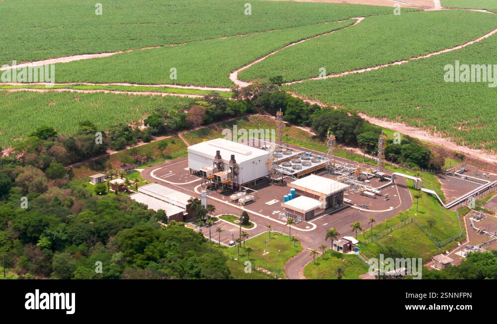 Gas pipeline station surrounds within lush, green farmland of Brazil ...