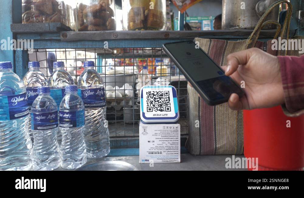 Customer scanning Paytm QR codes for fast UPI payment at Indian street ...