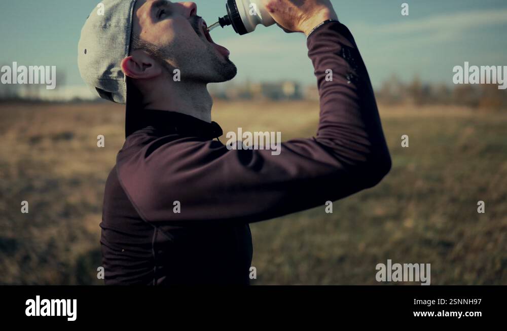 Quenching thirst. bottle of water. Maintaining hydration Stock Video ...