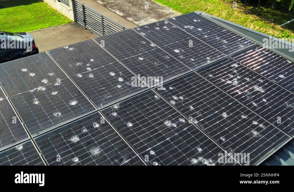 Drone 4k footage of solar panels on a house roof severely damaged by a ...